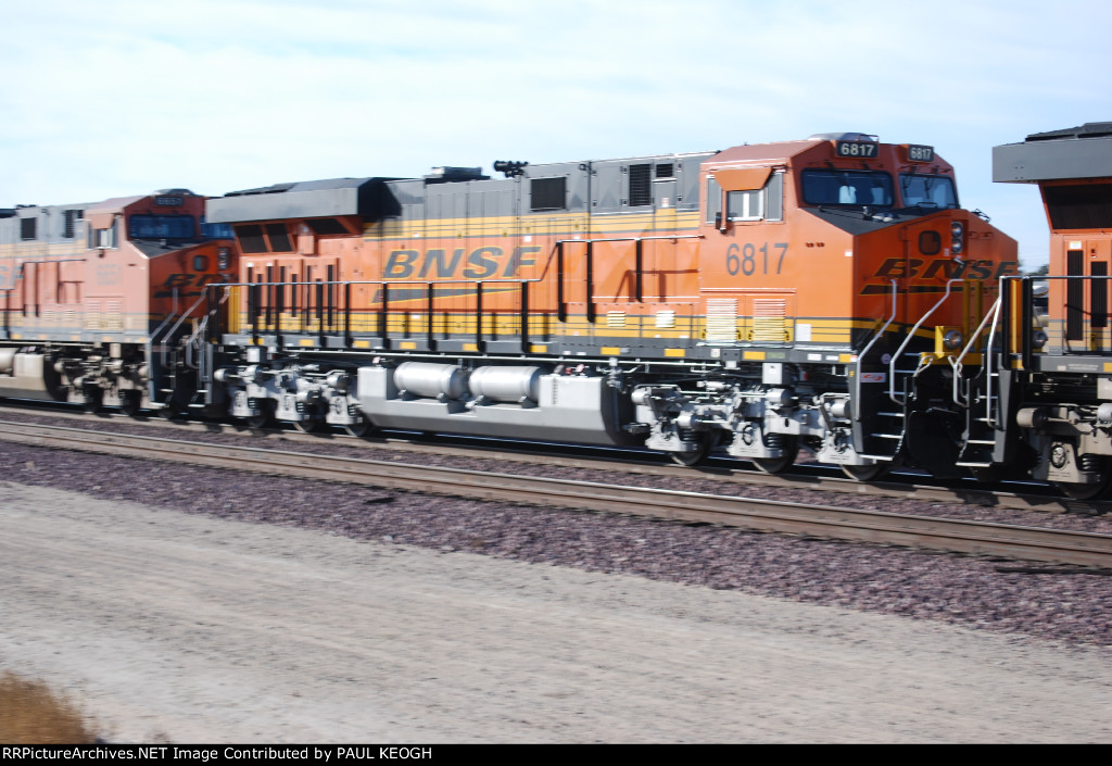 BNSF 6817 passes me by as she rolls west.